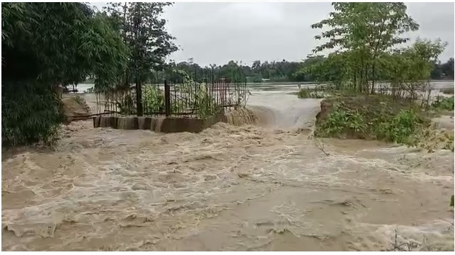 River water flowing into Silchar through Bethukandi embankment; "Public ...